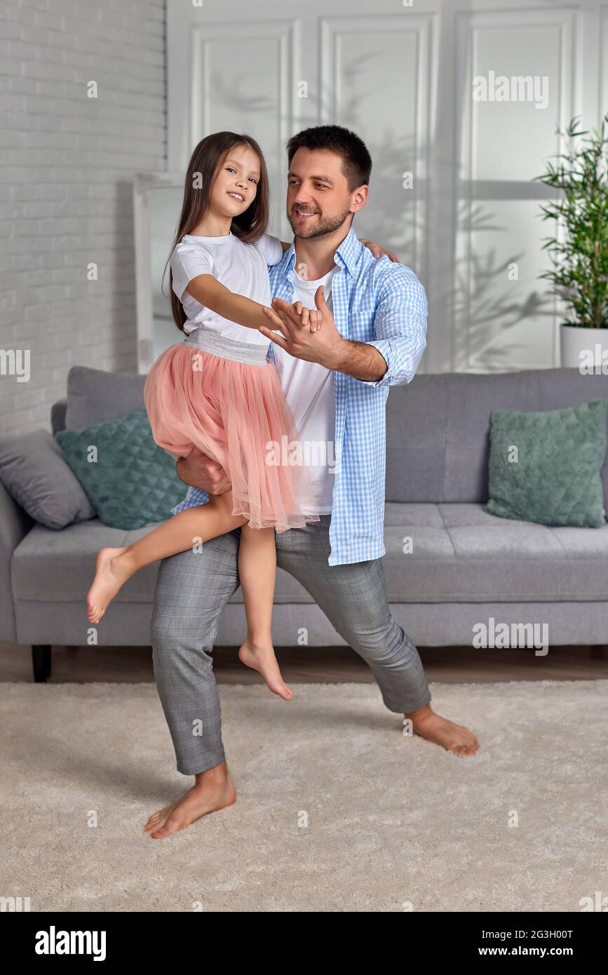 father dancing with his little cute daughter at home Stock Photo - Alamy