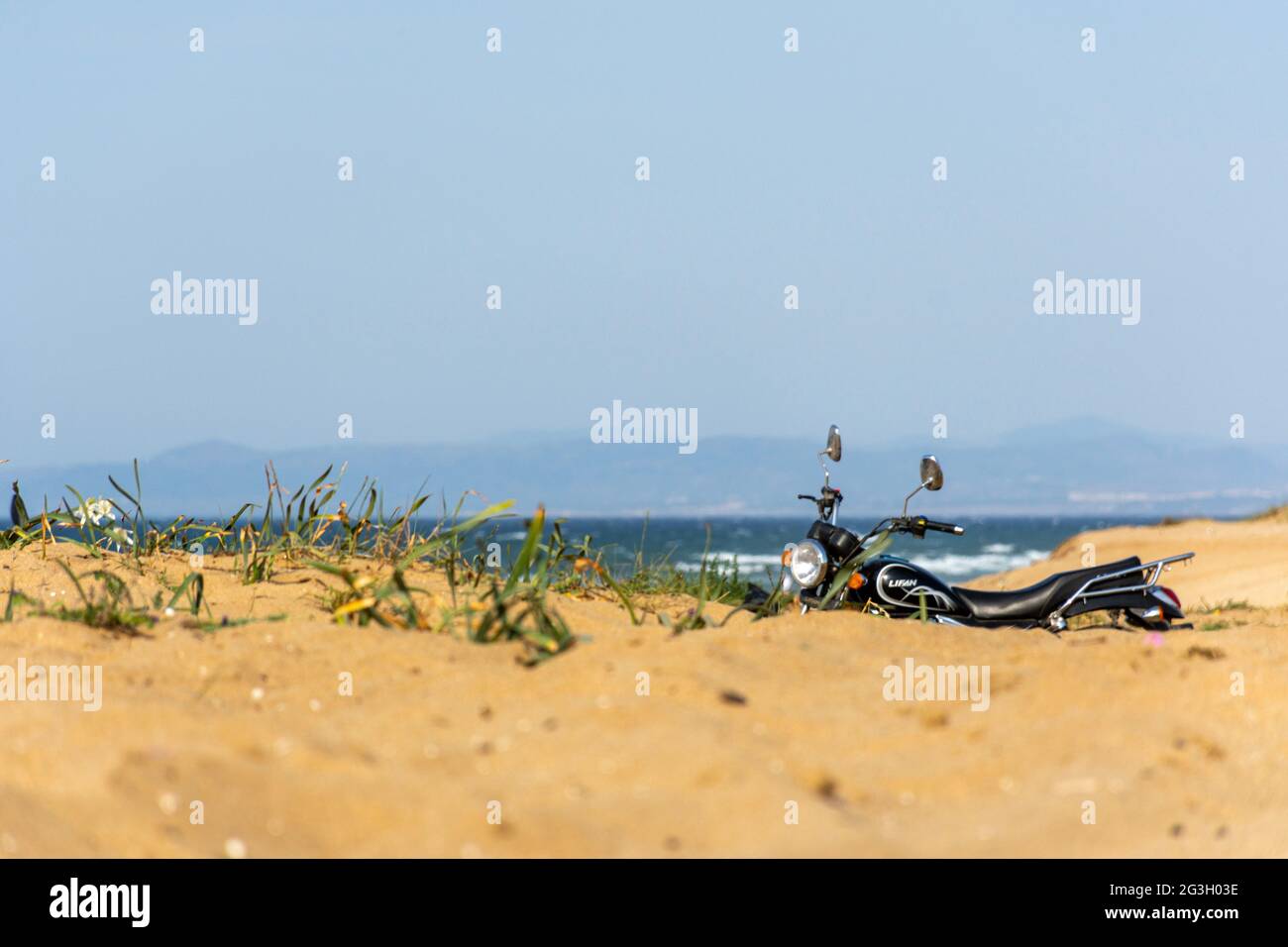 Motorcycle on beach blue sky hi-res stock photography and images - Alamy