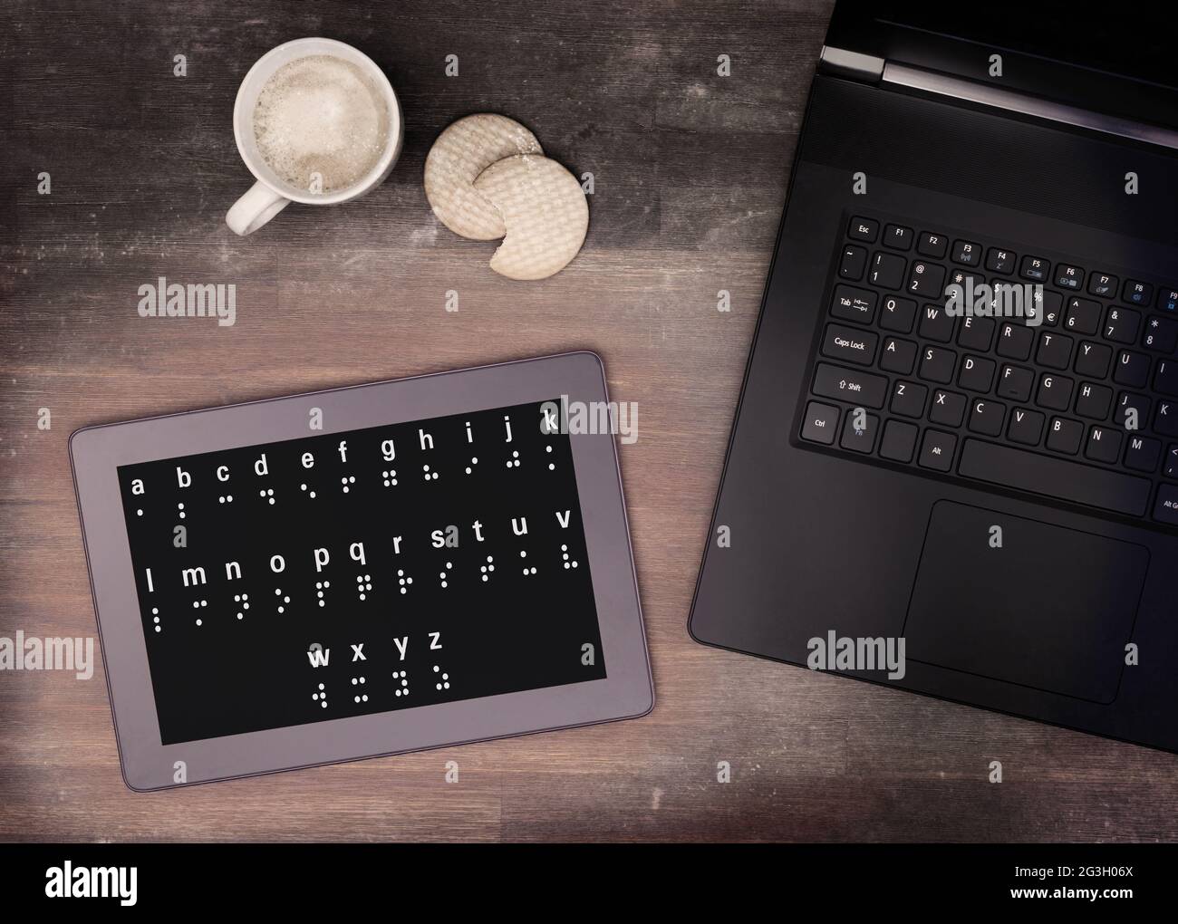 Braille on a tablet, concept of impossibility Stock Photo - Alamy