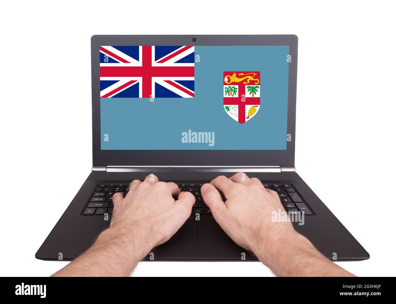 Hands working on laptop, Fiji Stock Photo - Alamy