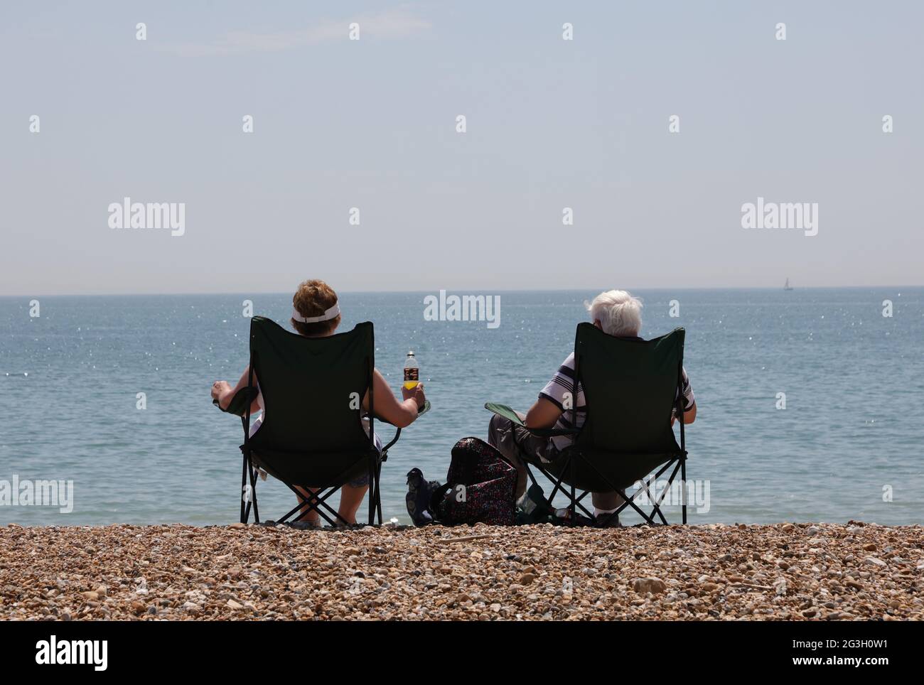 People seen sitting in chairs on the beach of Bognor Regis, during a ...