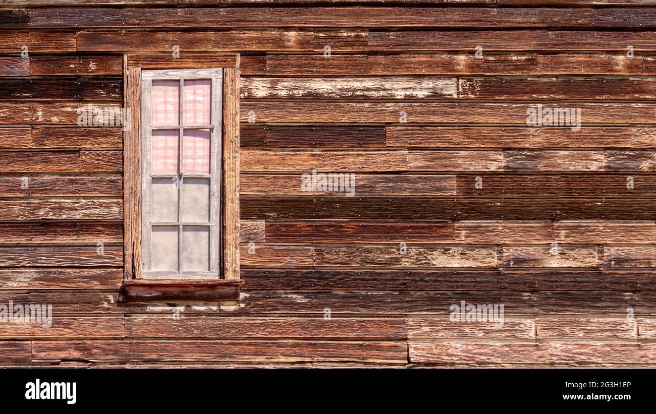 Old western style rustic wooden exterior wall with a framed window ...