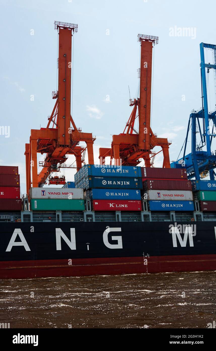 large cargo ship docked; cargo containers; close-up, bulk carrier, work ...