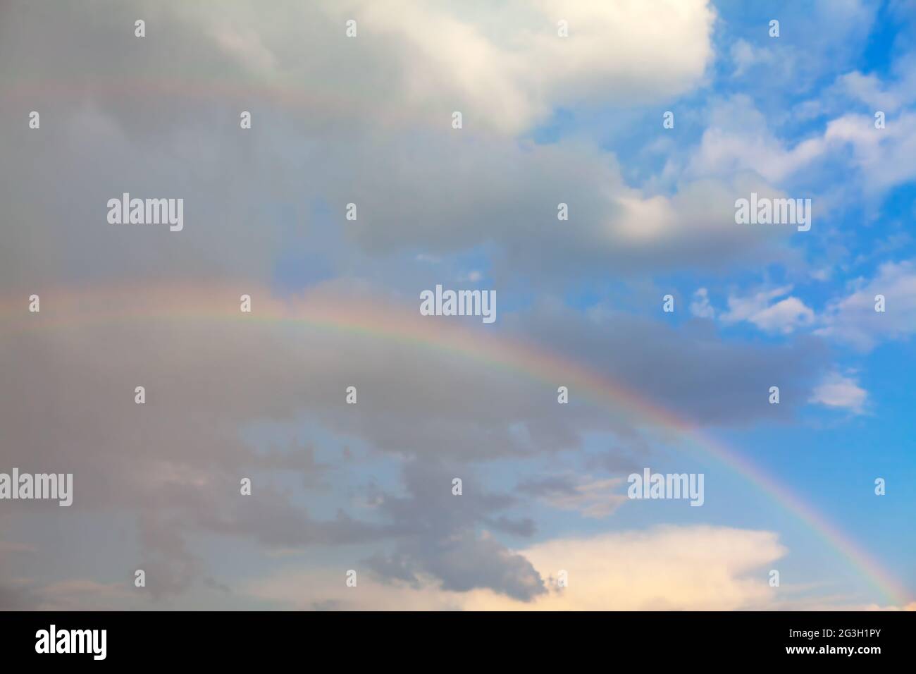 Real rainbow in the summer day . Natural spectrum on the sky Stock ...