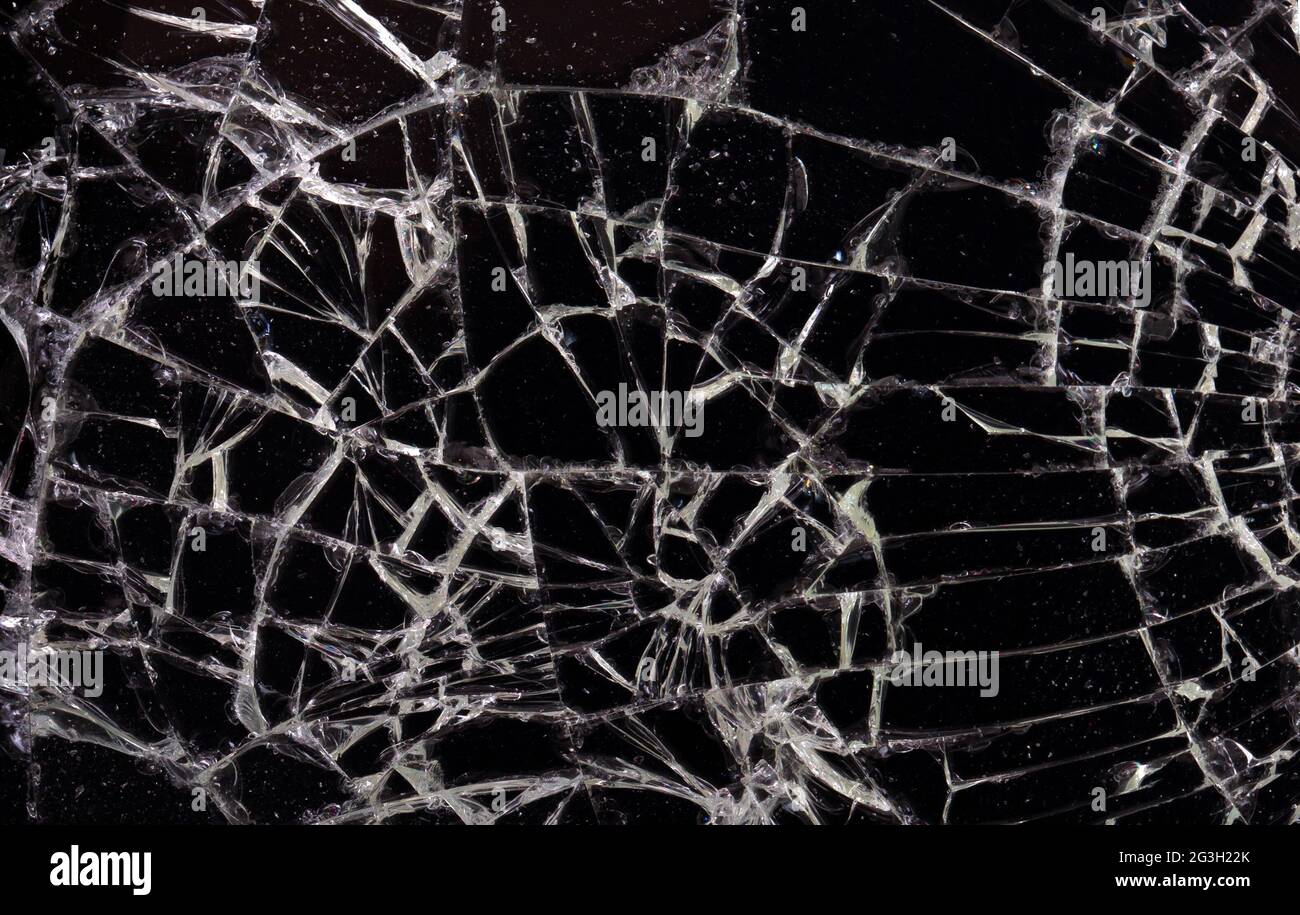Full screen broken glass, black background Stock Photo - Alamy