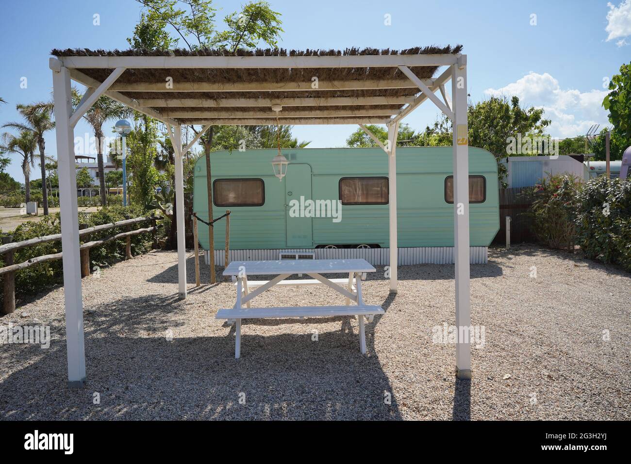 Small cabin with green walls and a yard Stock Photo - Alamy