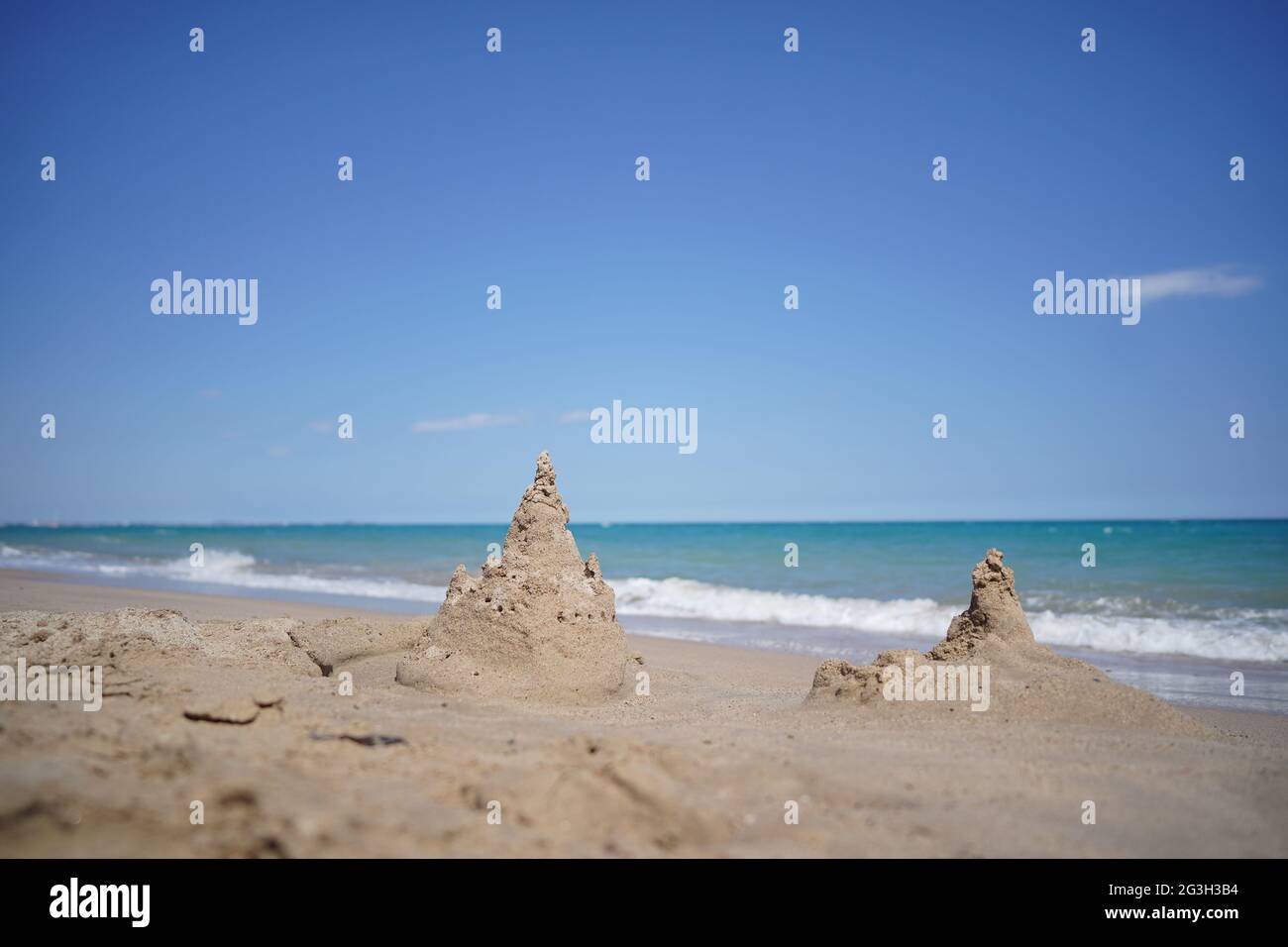 Sand castles at an empty beach Stock Photo - Alamy