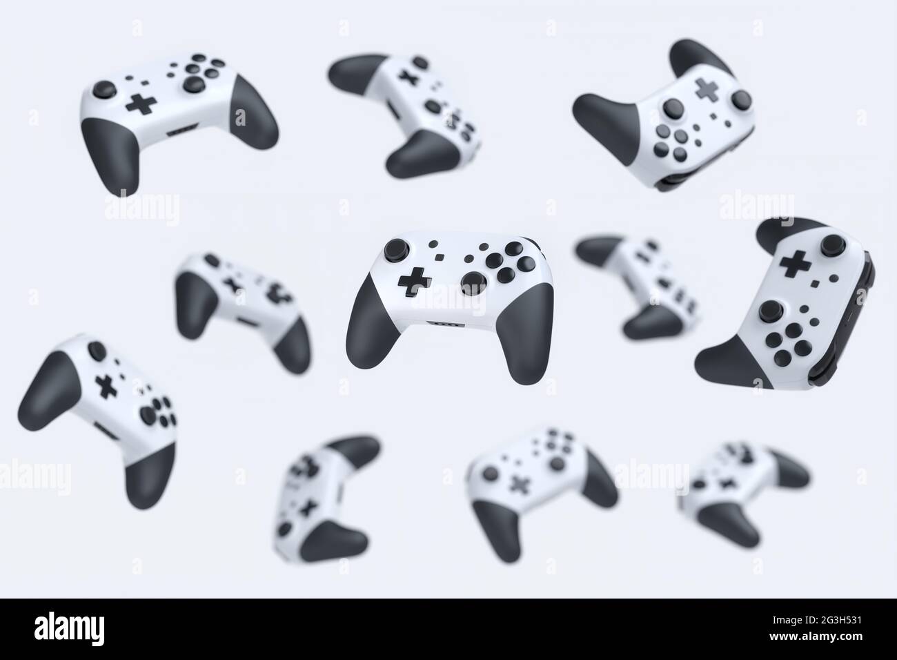 Flying gamer joysticks or gamepads on white background with blur Stock ...