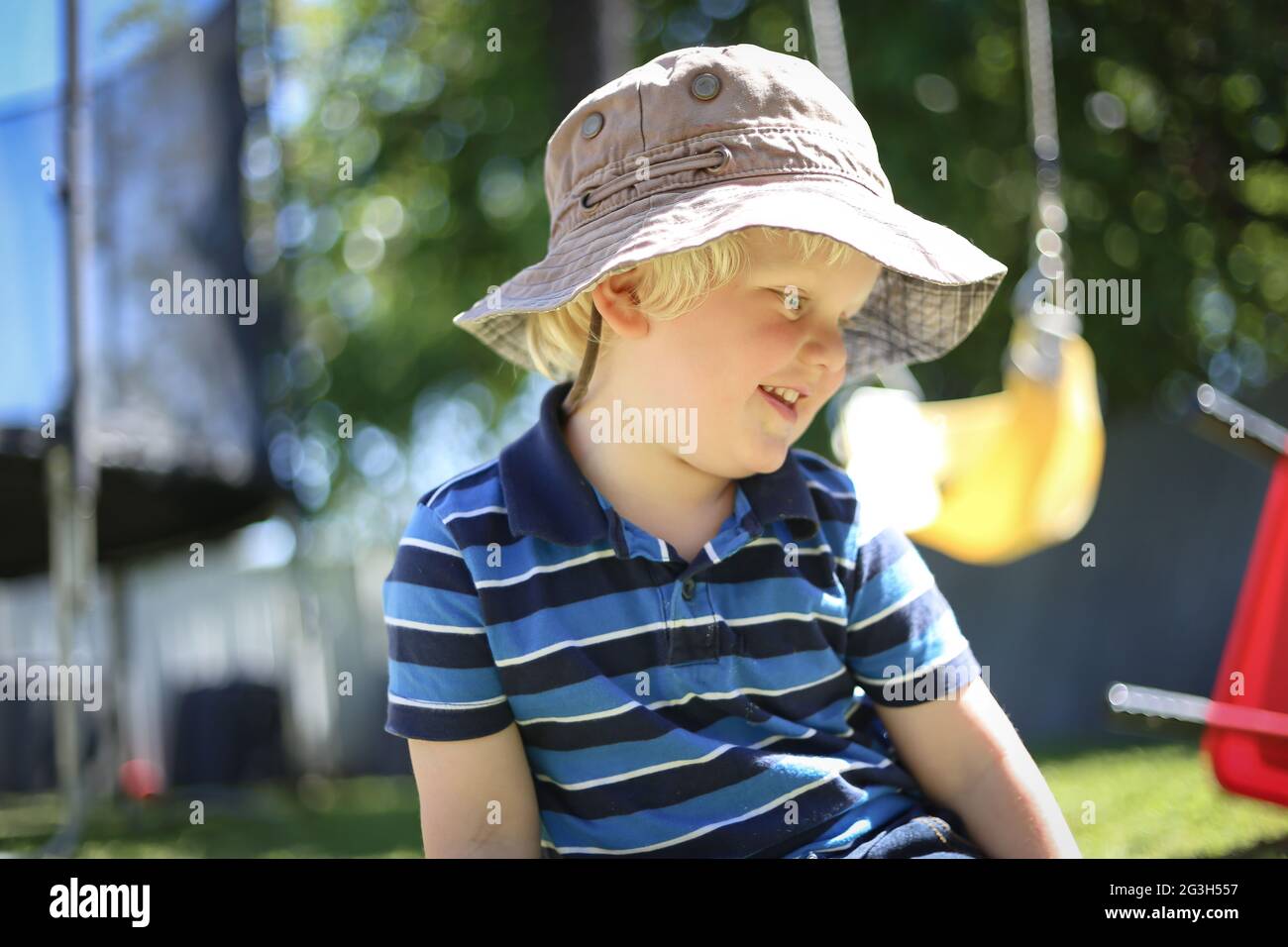 Happy adorable blonde Australian kid in the playground Stock Photo - Alamy