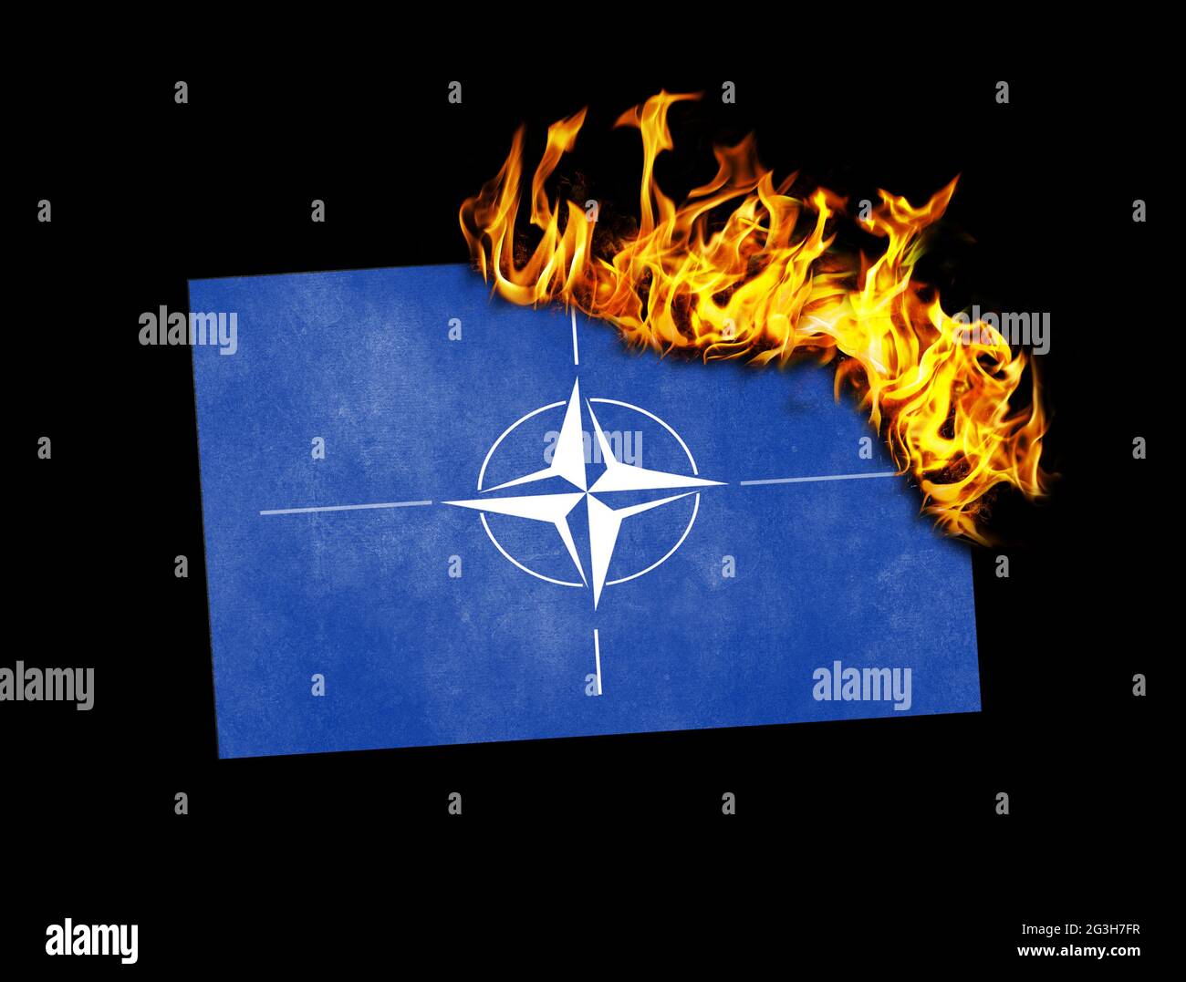 Flag burning - NATO Stock Photo - Alamy