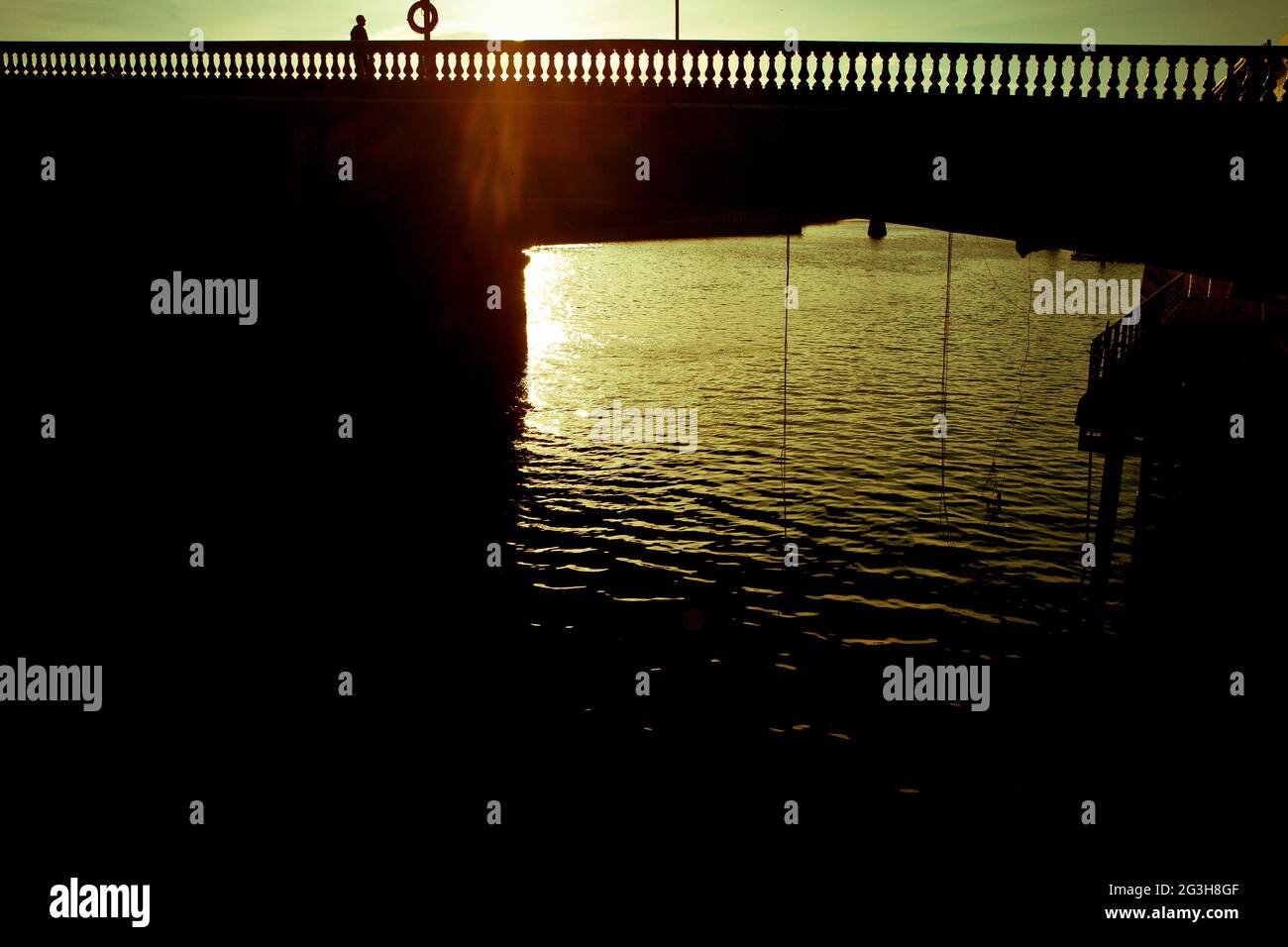 Person by bridge hi-res stock photography and images - Alamy