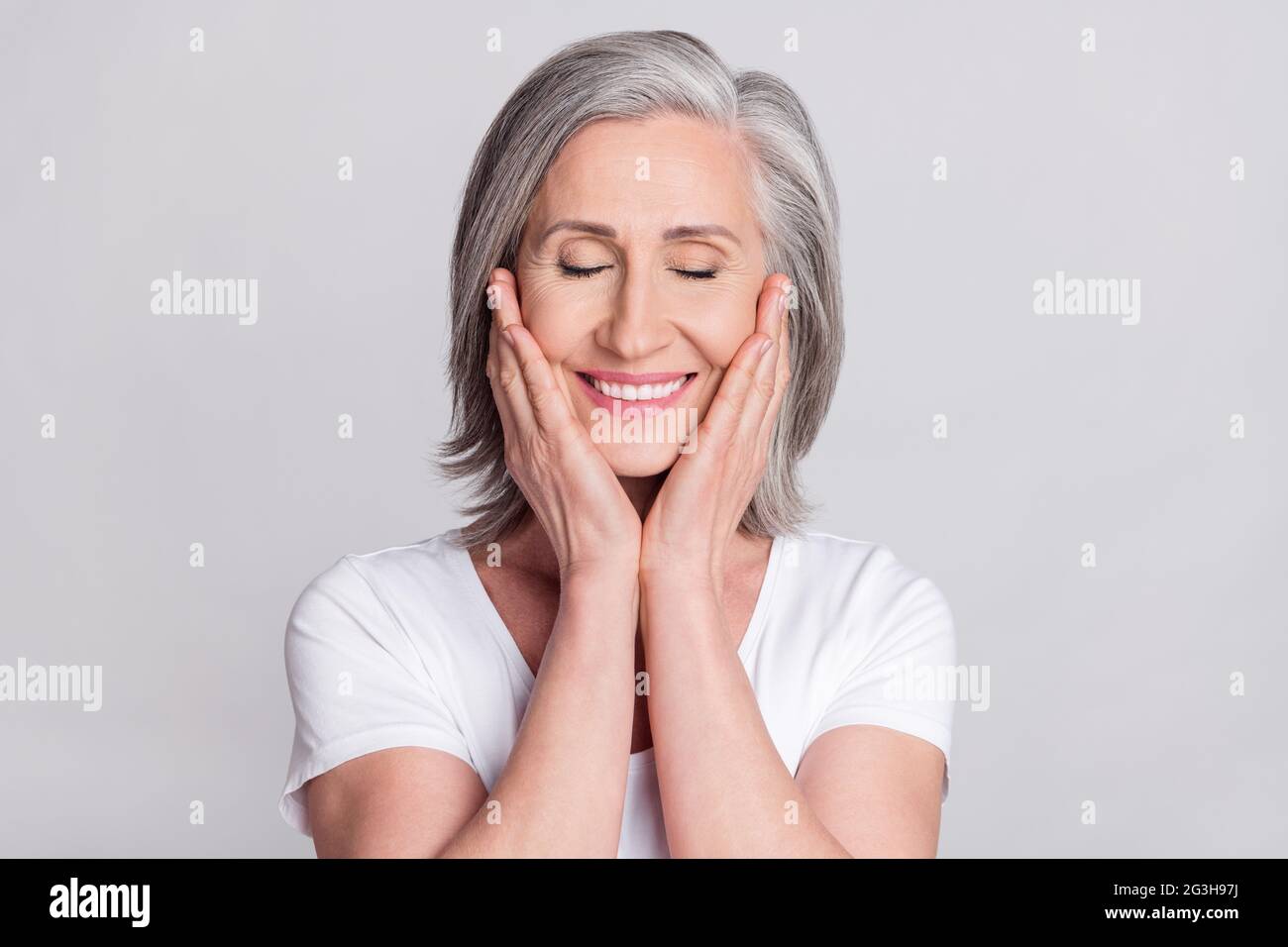 Photo of pretty charming age woman dressed white outfit smiling closed ...