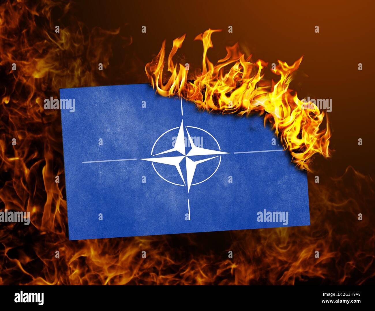 Flag burning - NATO Stock Photo - Alamy