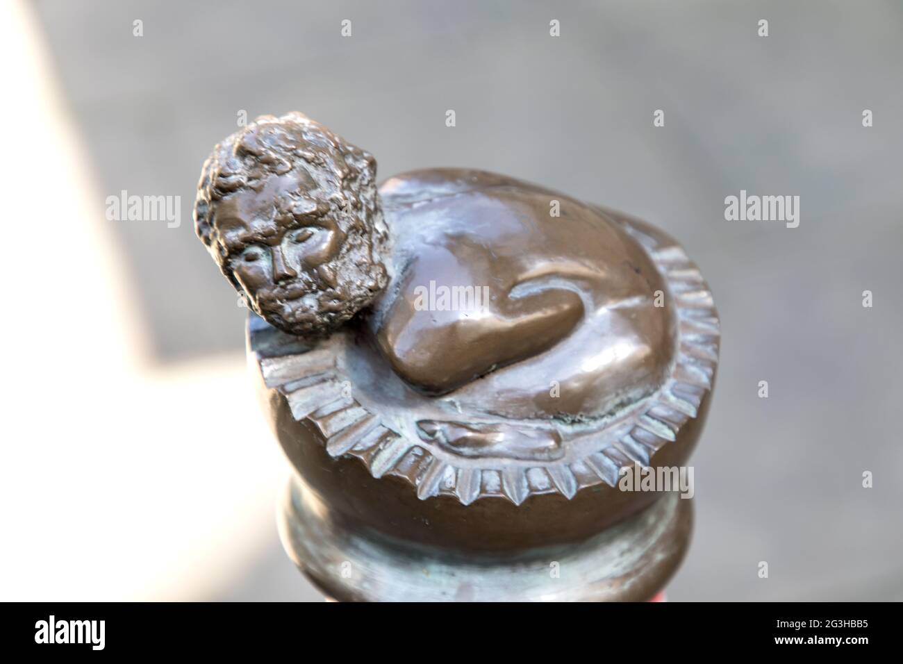 Bronze sculpture of Peter the wild boy, child, man, on a bollard in ...