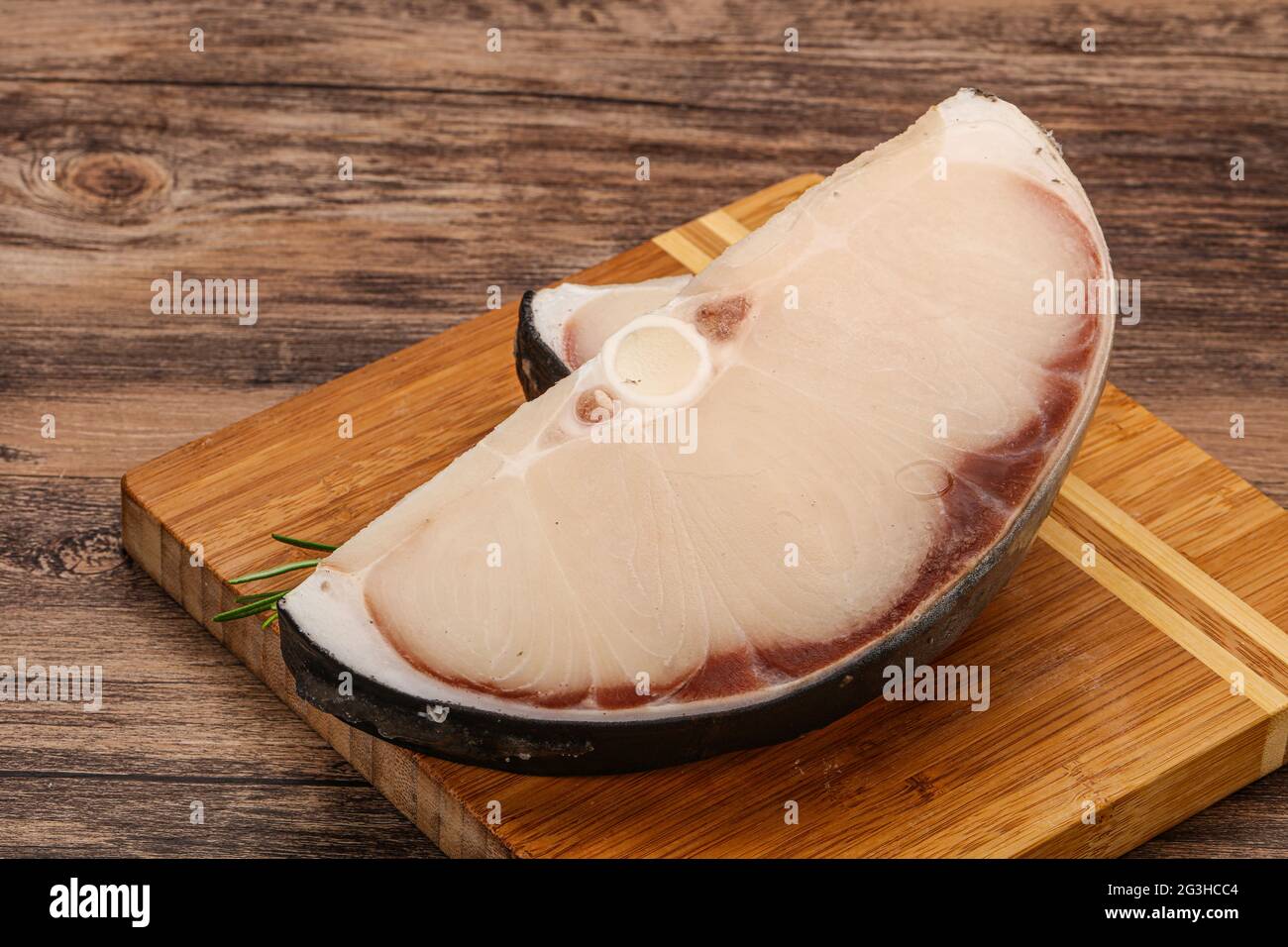 Raw shark steak served rosemary for cooking Stock Photo - Alamy