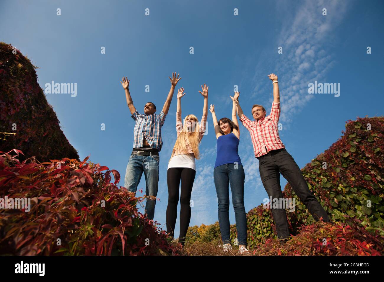 People rise up hands acrosss sky Stock Photo - Alamy