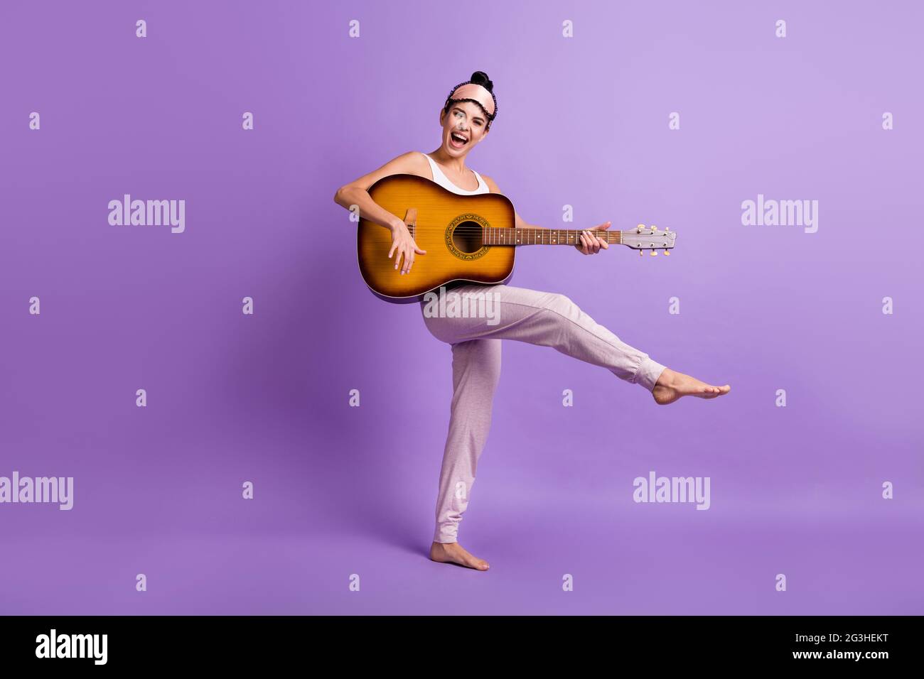 Full length profile portrait of crazy cheerful person playing guitar ...