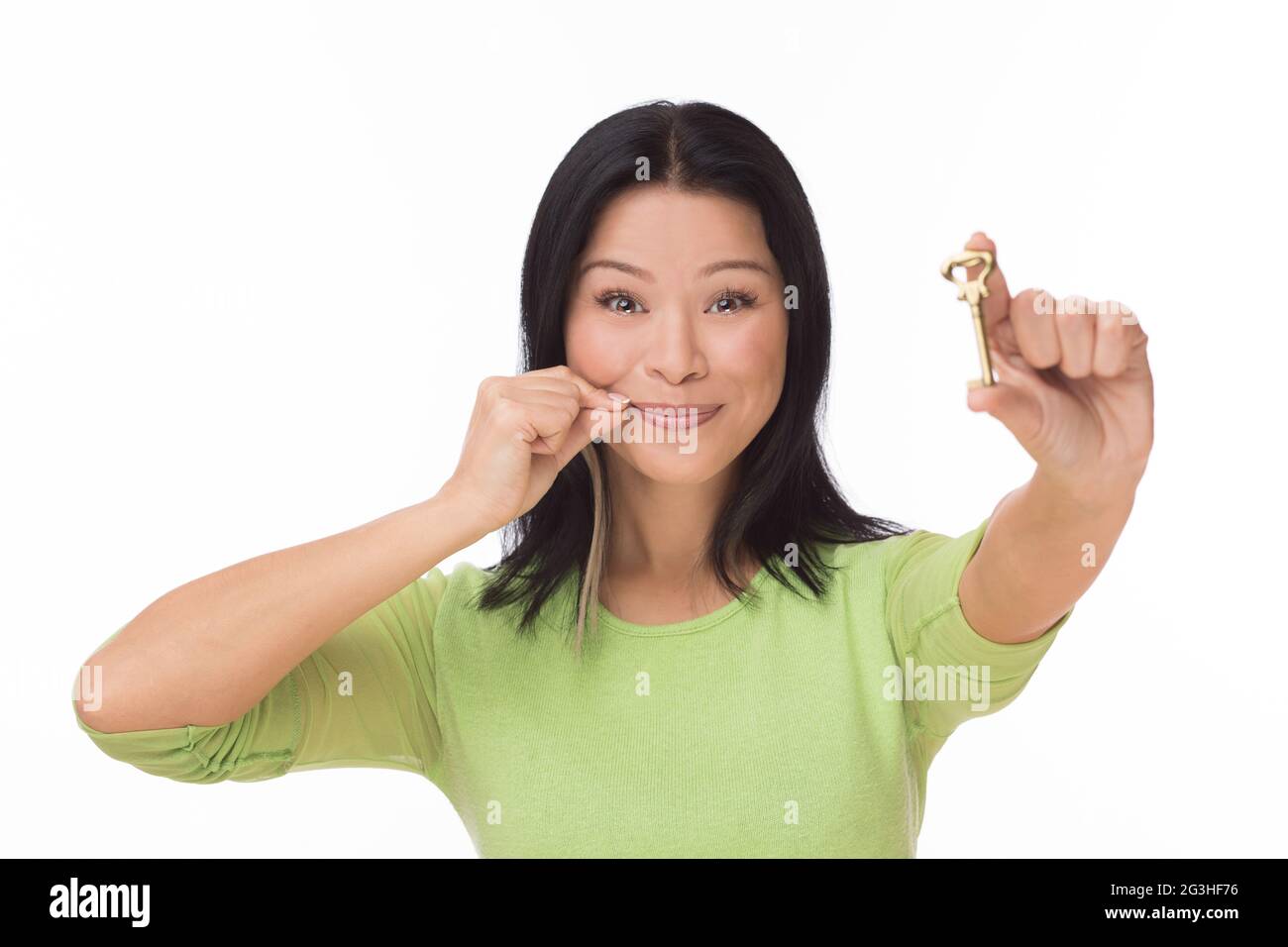 Woman locked mouth with key on white Stock Photo - Alamy