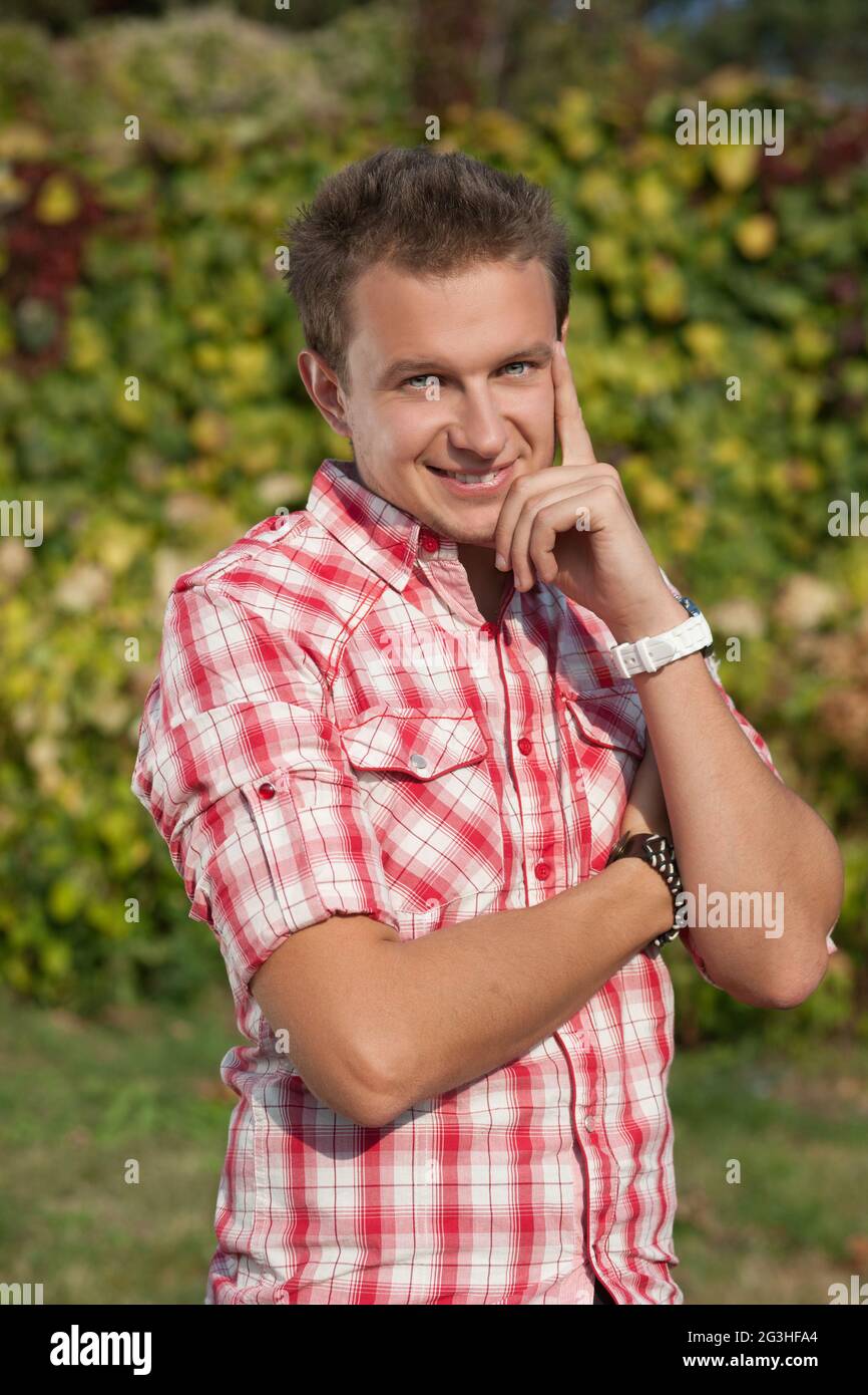 Young man show love sign Stock Photo - Alamy