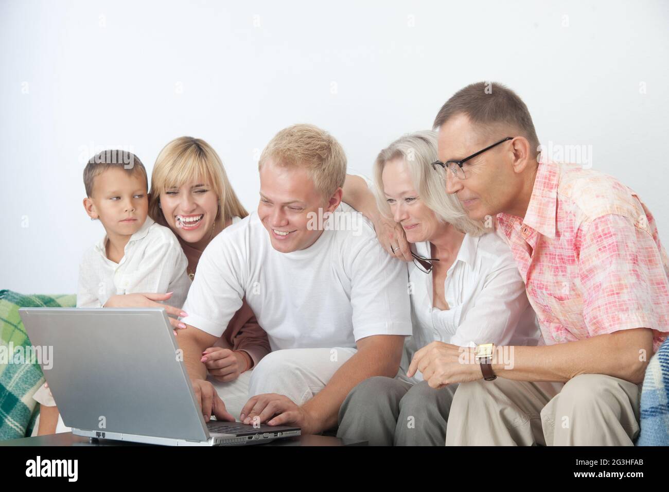 Family with computer Stock Photo - Alamy