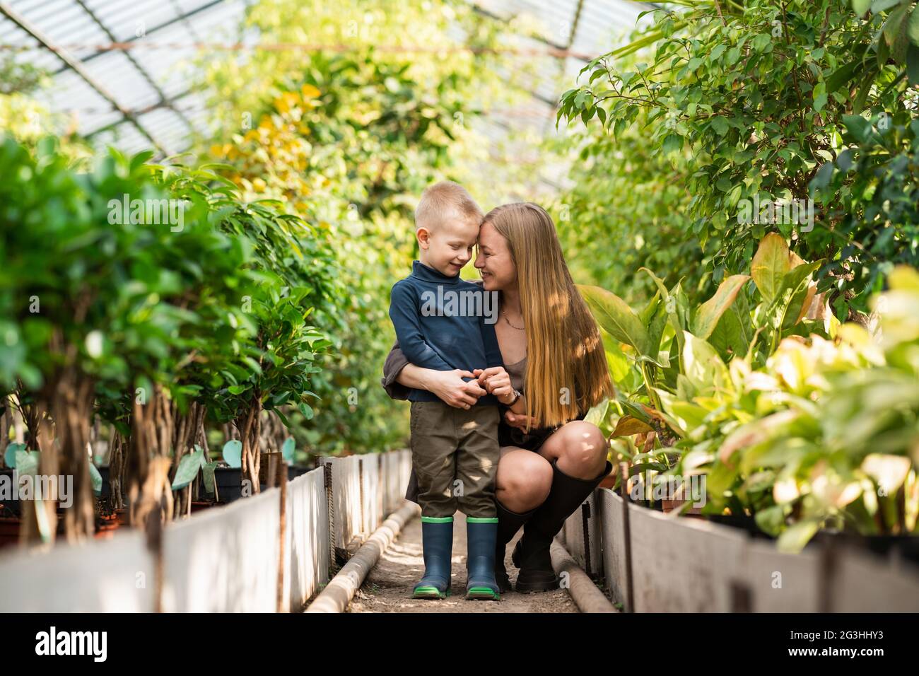 Child hugs mother in nature hi-res stock photography and images - Alamy