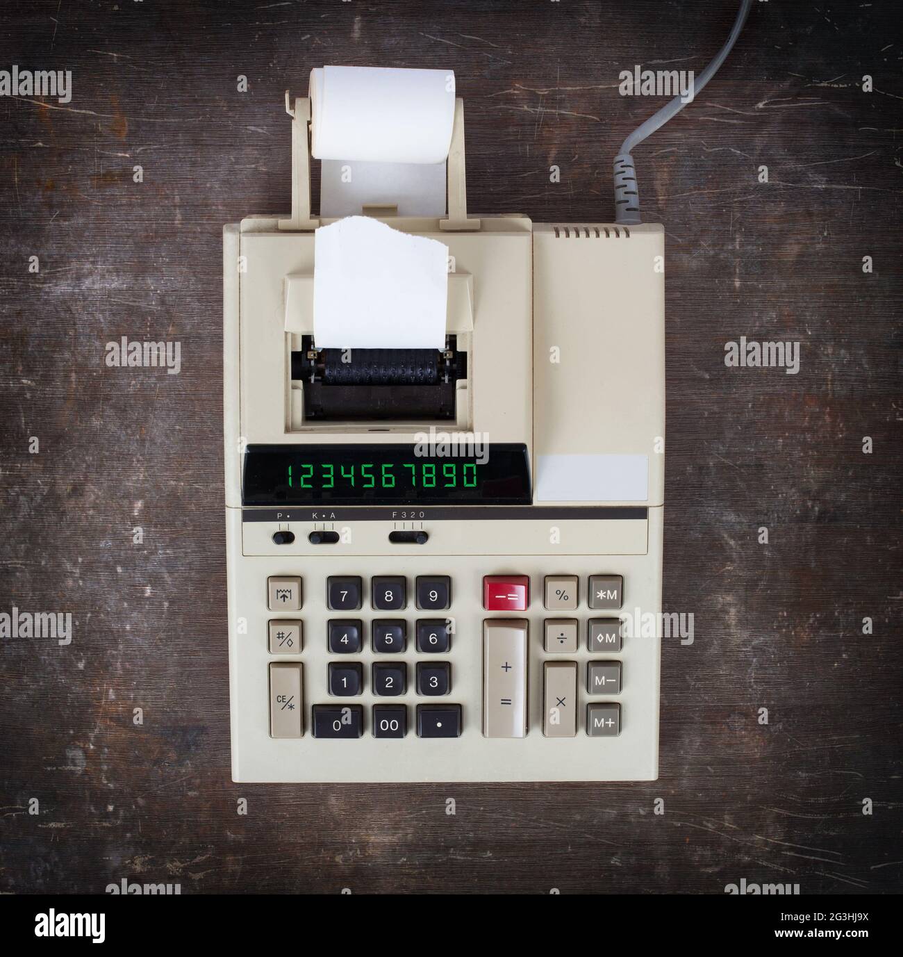 Old calculator showing a range of numbers Stock Photo - Alamy