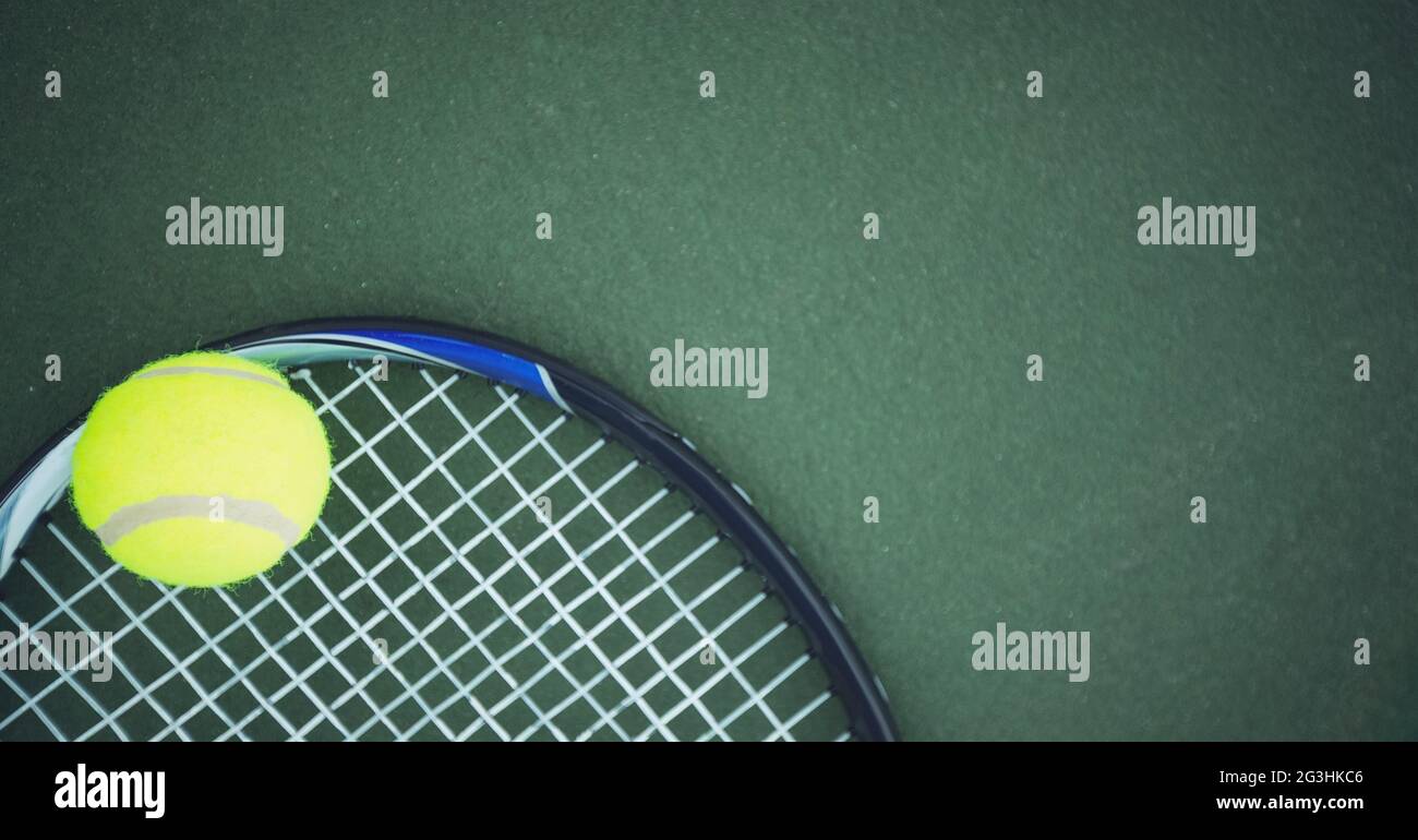 Composition of tennis ball and racket with copy space on tennis court ...