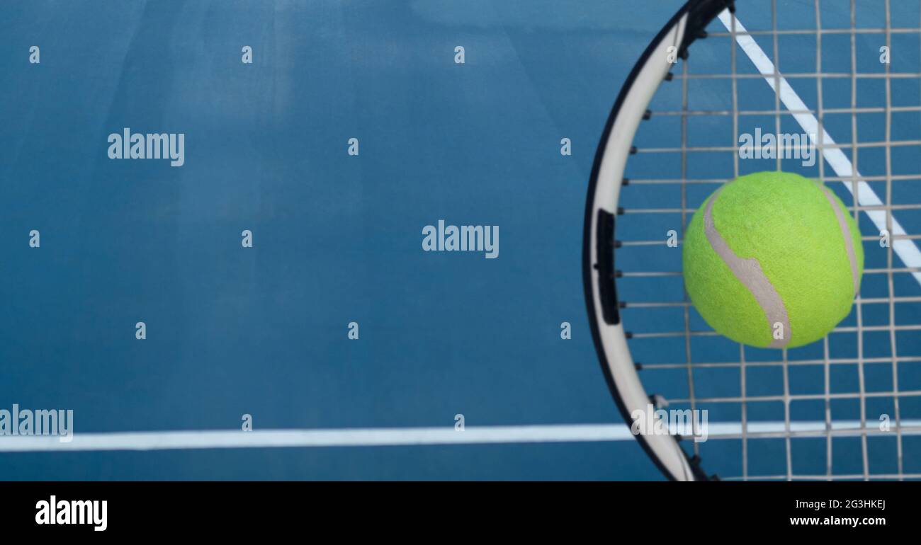 Composition of tennis ball and racket with copy space on tennis court ...
