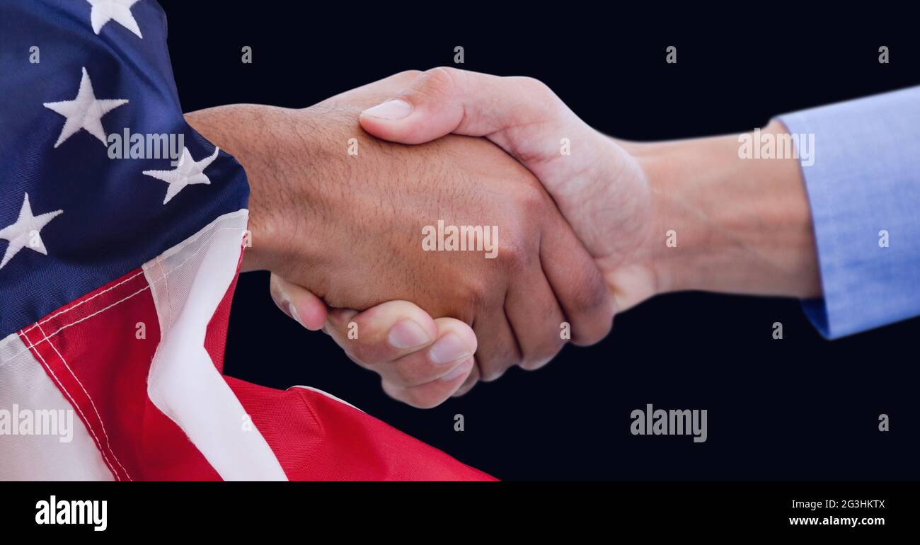 Composition of hands of two diverse people shaking hands and american ...