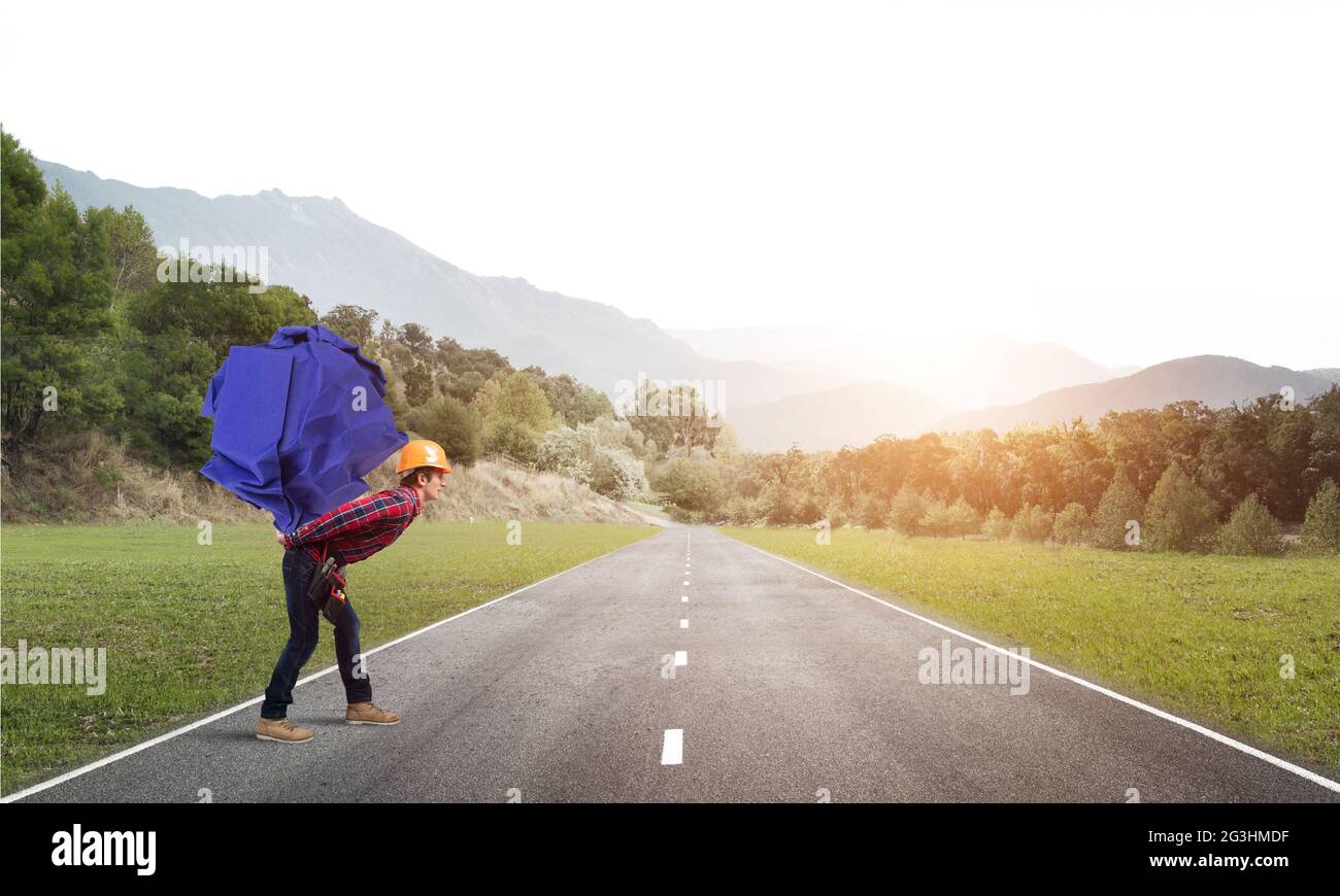 Engineer man carry load Stock Photo - Alamy
