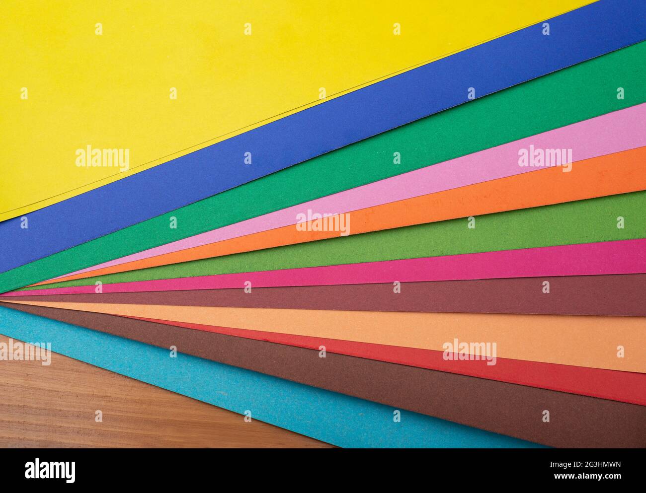 Multi color card board making colorful background on table Stock Photo ...