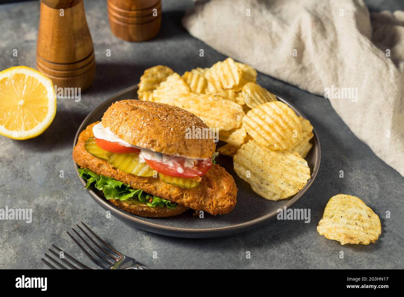 Homemade Crispy Fried Fish Fillet Sandwich with Chips Stock Photo - Alamy