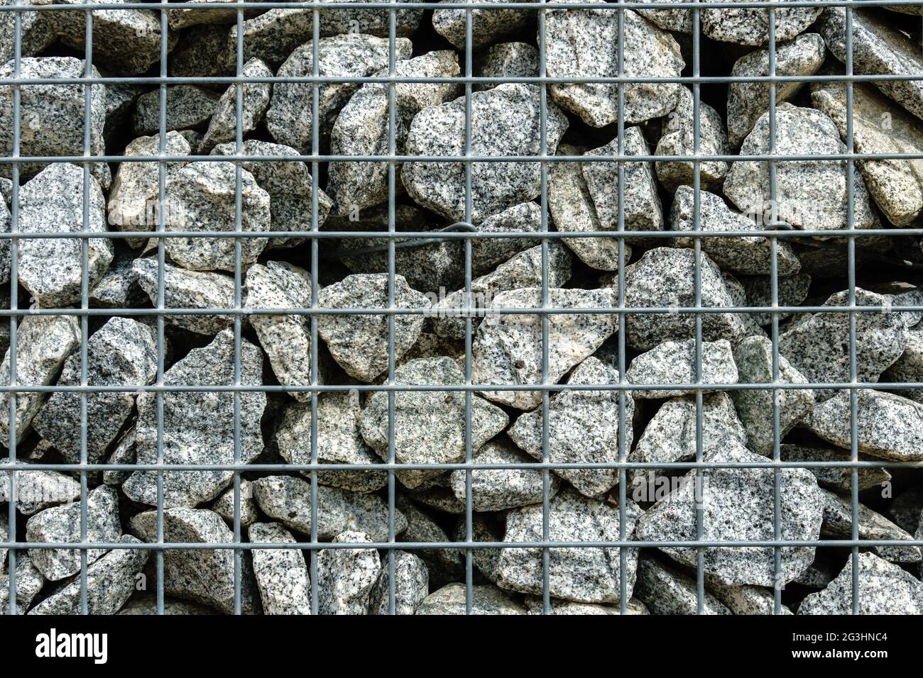 Small rocks or gravel, used for construction within a wire fence Stock ...