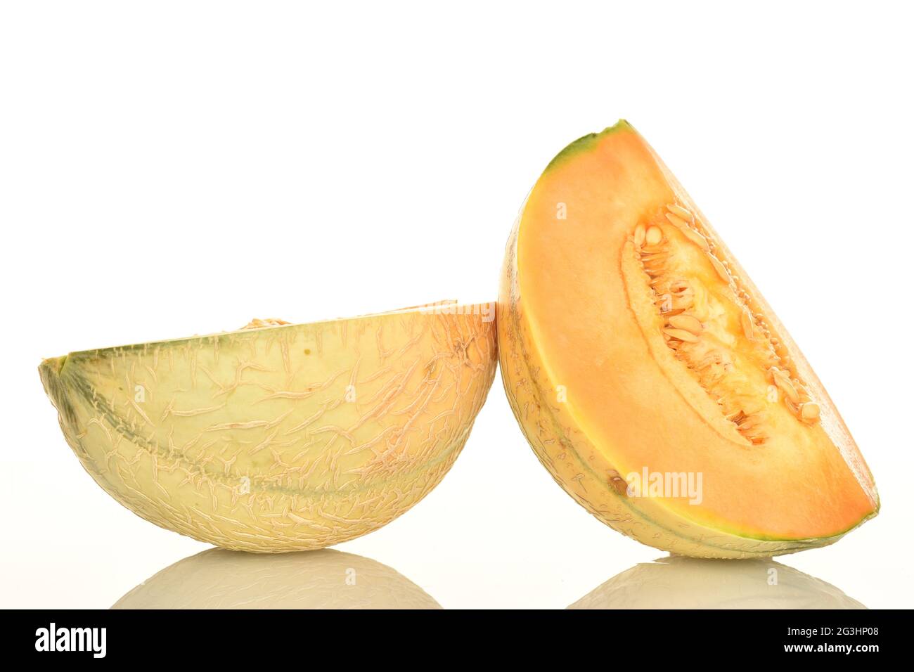 Two halves of fragrant juicy organic melons, close-up, over white ...
