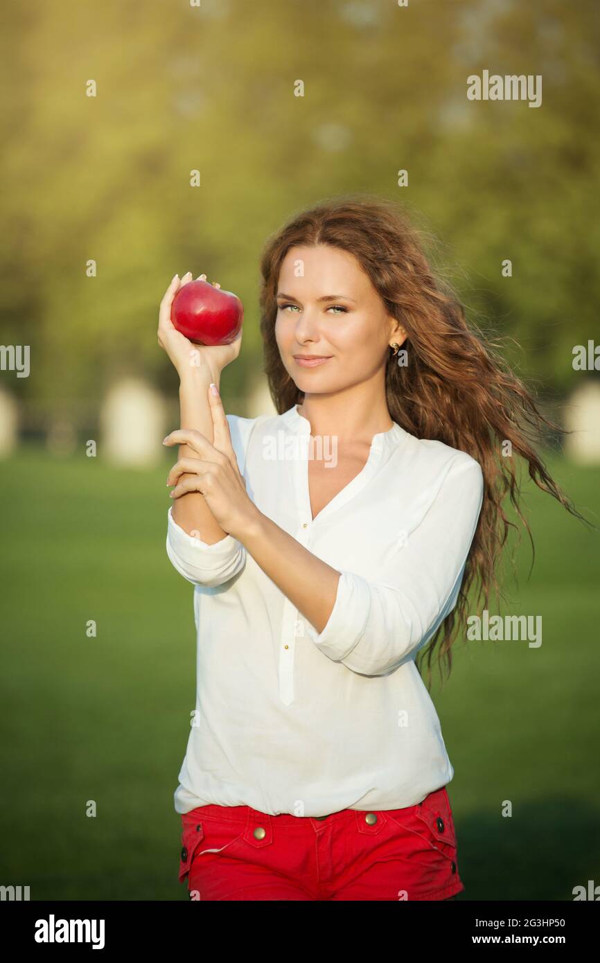 Woman with apple Stock Photo - Alamy