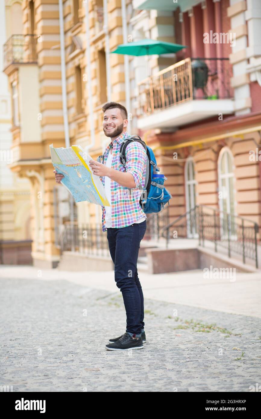 Young hipster man with map Stock Photo - Alamy