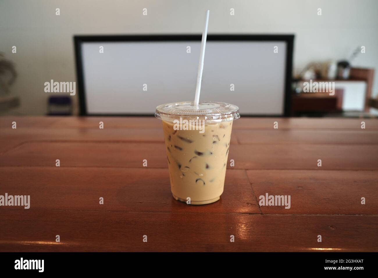 Iced Latte in a cup at coffee shop Stock Photo - Alamy