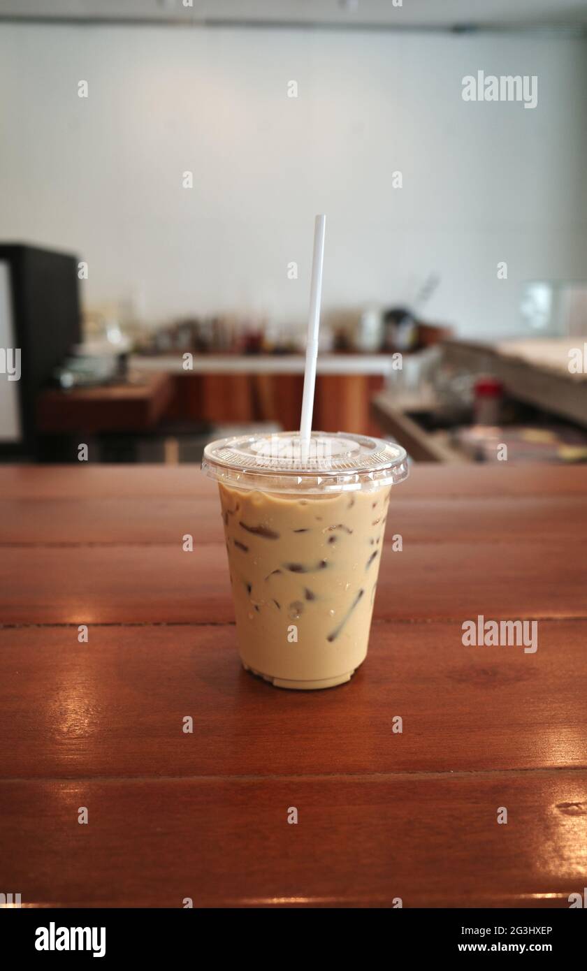 Iced Latte in a cup at coffee shop Stock Photo - Alamy