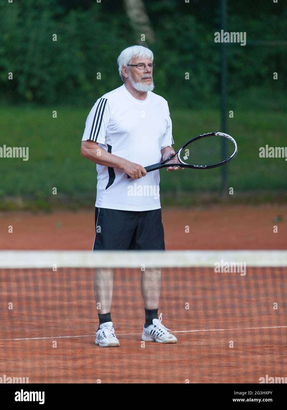Senior man playing tennis Stock Photo - Alamy