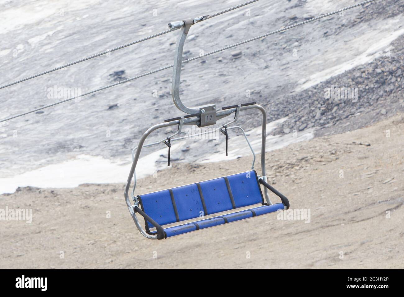 Empty ski lift above snow Stock Photo - Alamy