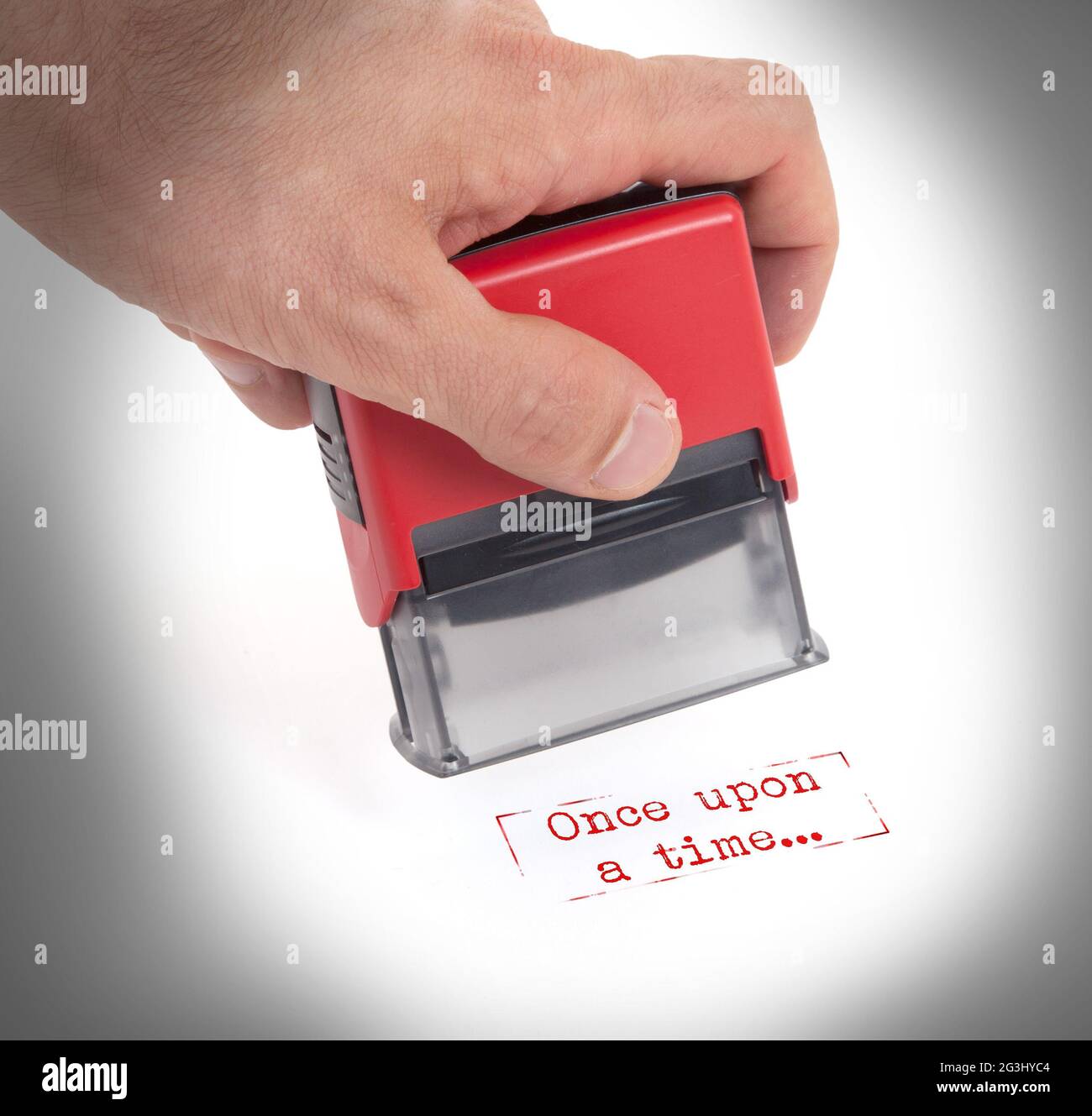 Plastic stamp in hand, isolated Stock Photo - Alamy