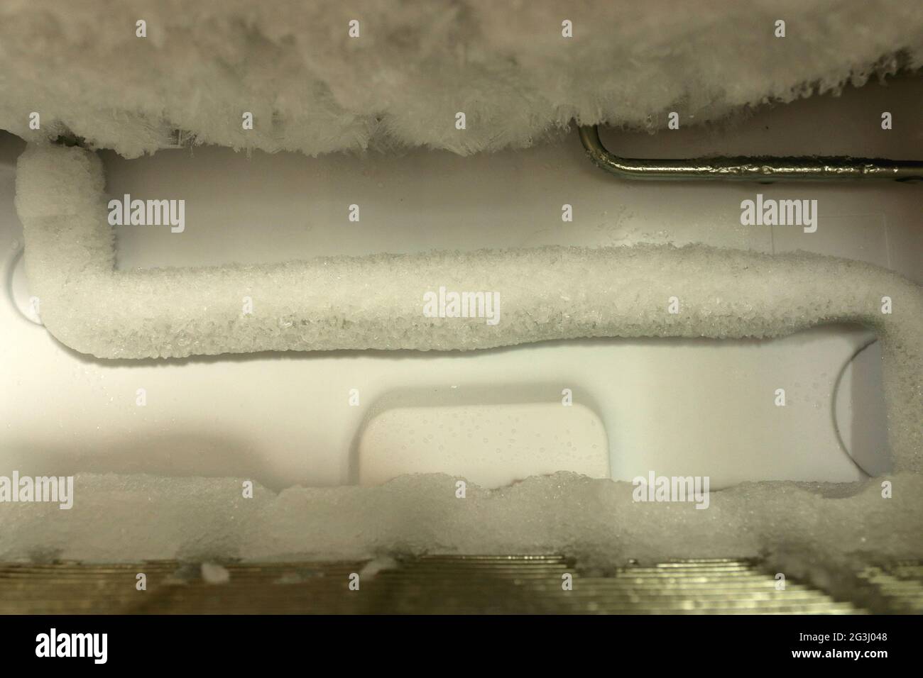Frozen, icy frost-covered refrigerator tubes in the refrigerator ...