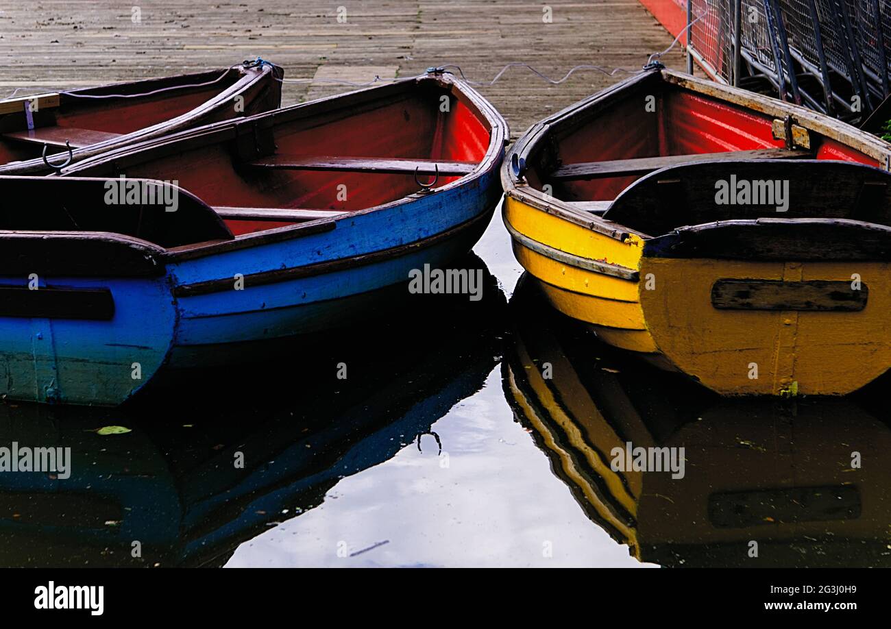 Coloured boats at boating lake Stock Photo - Alamy