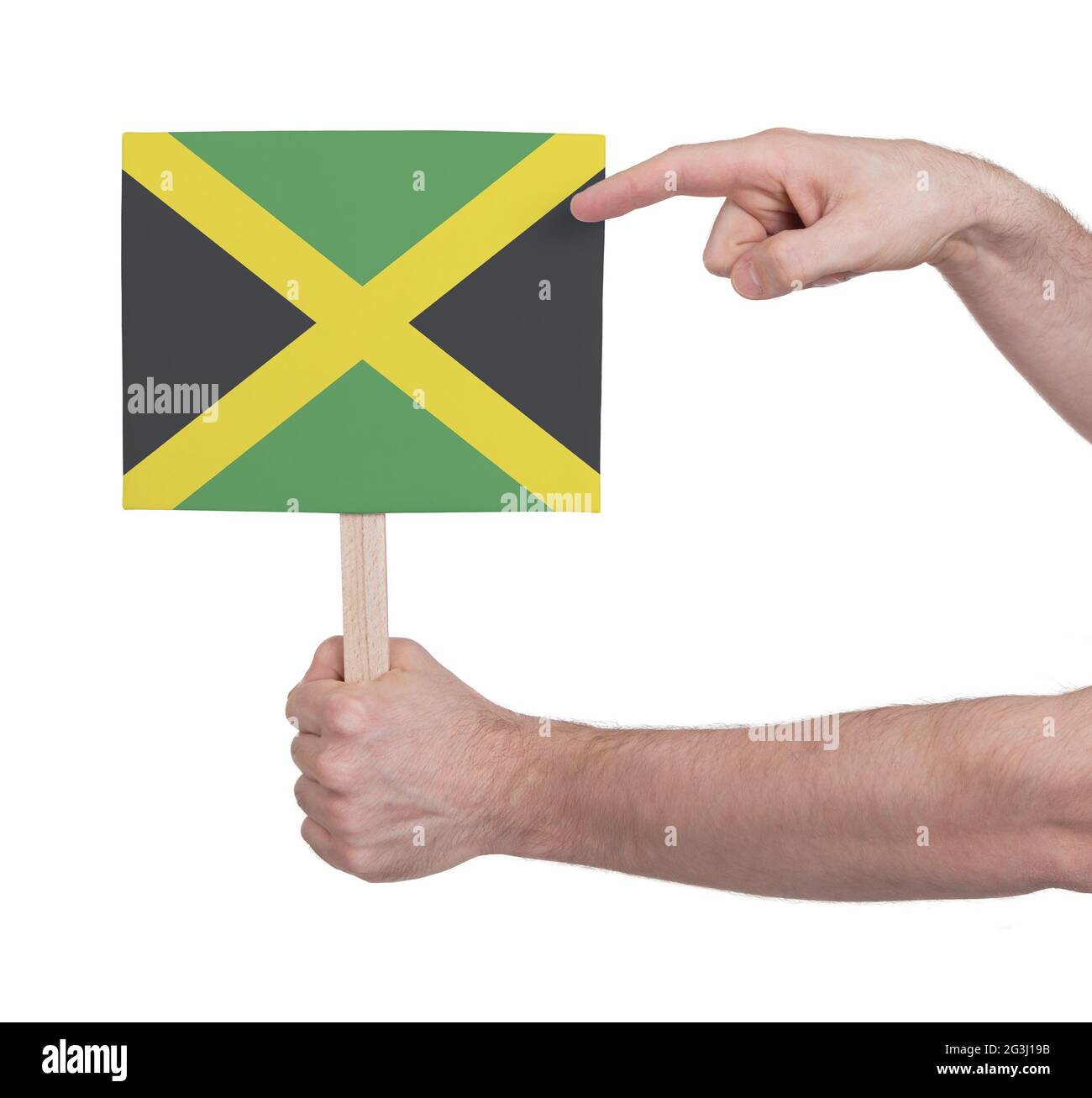 Hand holding small card - Flag of Jamaica Stock Photo - Alamy