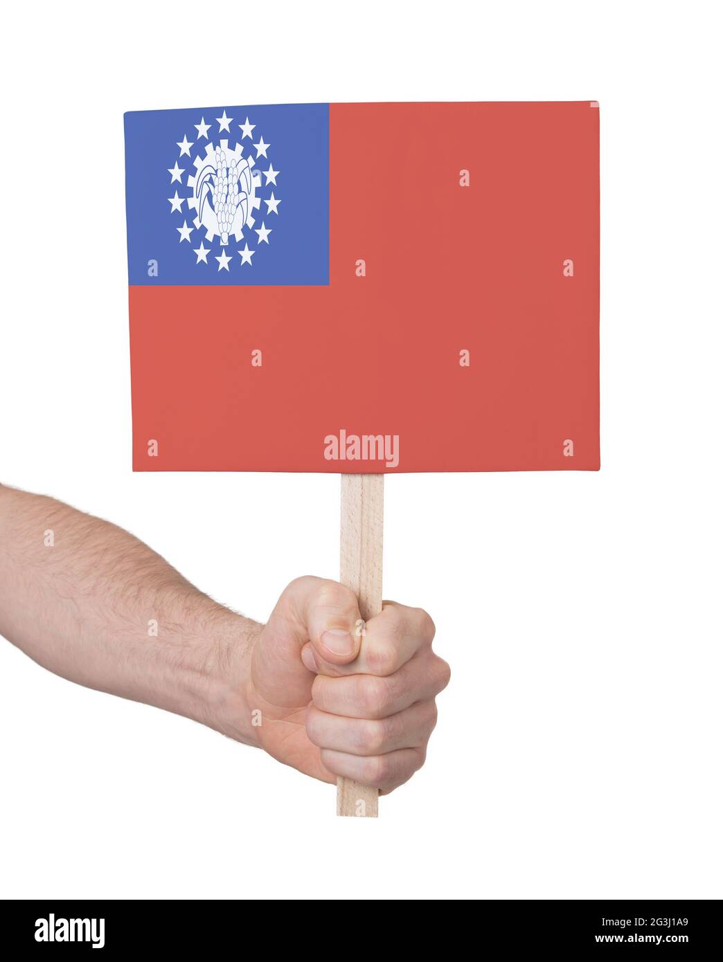 Hand holding small card - Flag of Myanmar Stock Photo - Alamy