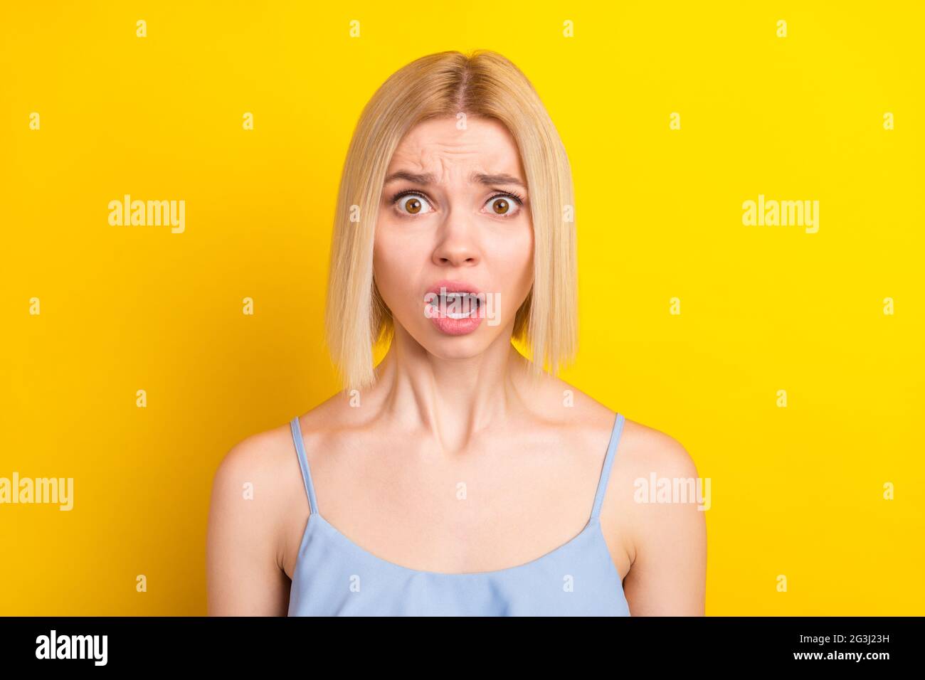 Photo of sad blond short hair lady open mouth wear blue top isolated on ...