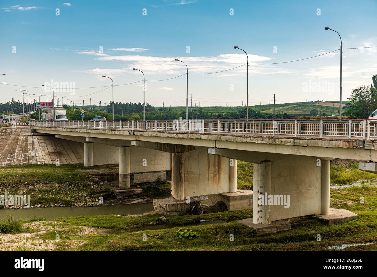 bridge over the Adagum River in the city of Krymsk with signs of water ...