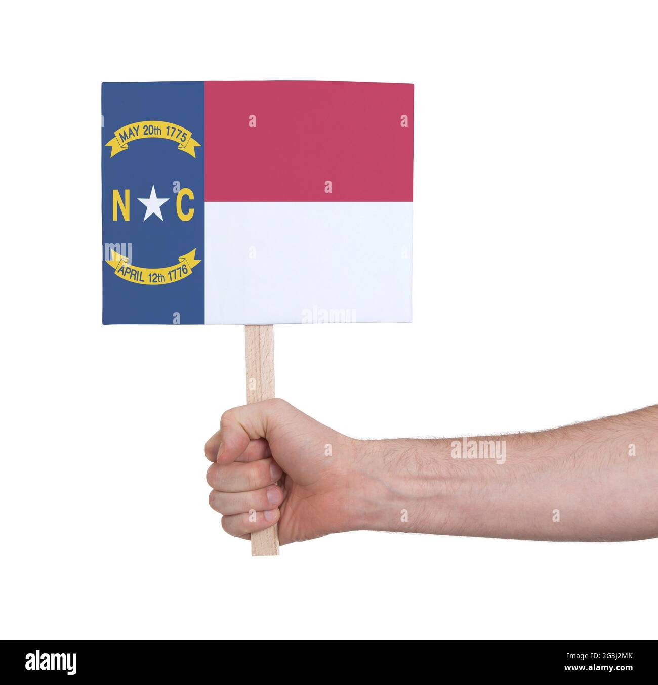 Hand holding small card - Flag of North Carolina Stock Photo - Alamy