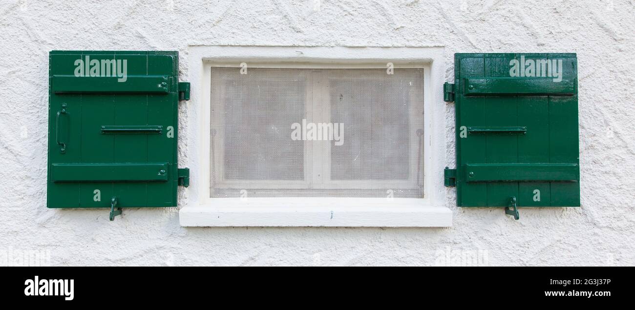 Open wooden green shutters Stock Photo - Alamy