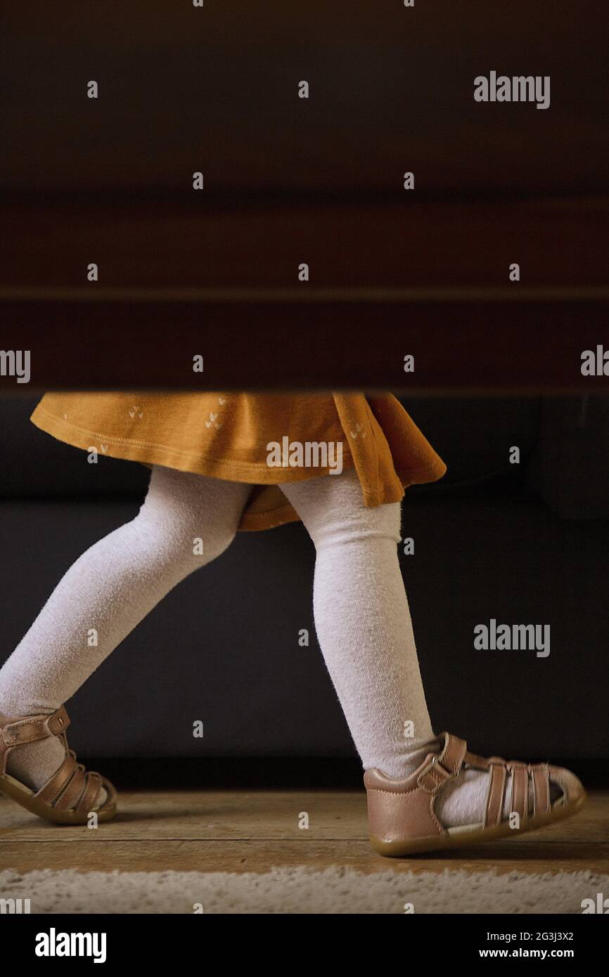 Vertical shot of a kid's legs walking at home Stock Photo - Alamy